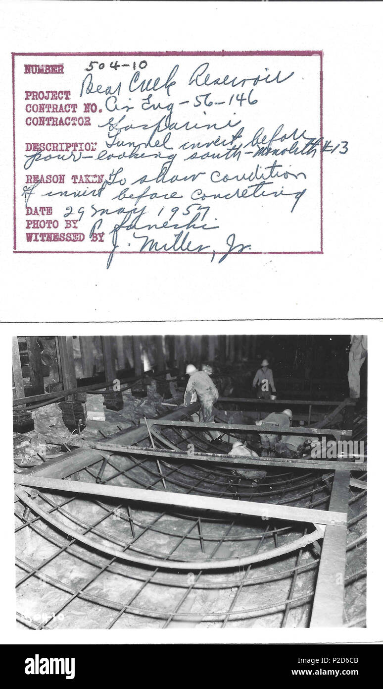 . English: Photo and progress card showing workers assembling the ...