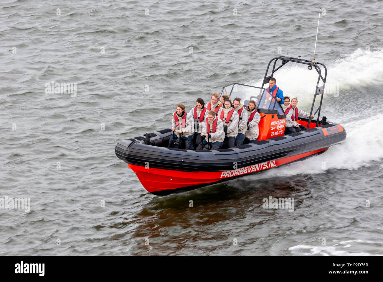 Water sports by speed boat with people at high speed Stock Photo - Alamy