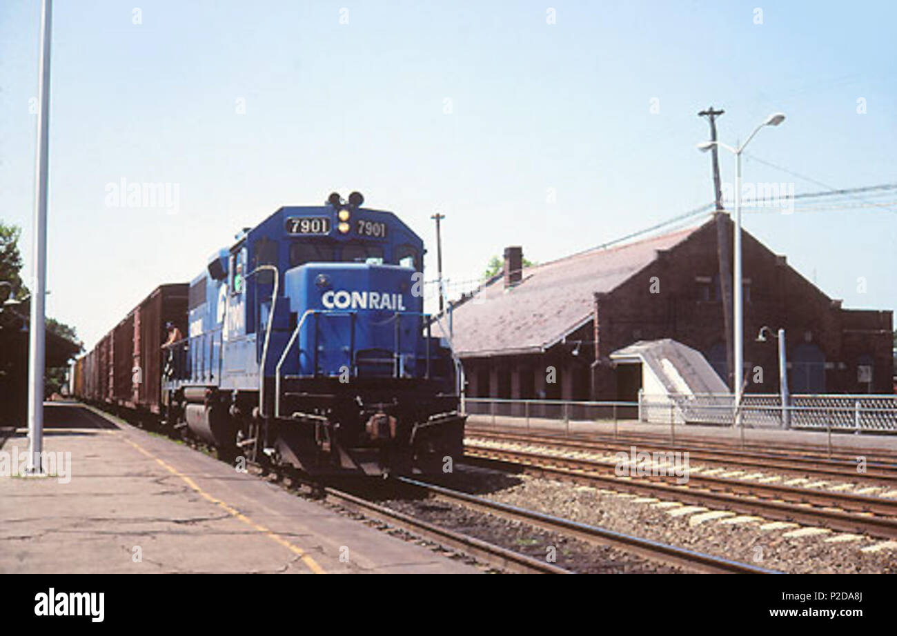 English: A Conrail freight train passes the then-closed Attleboro ...