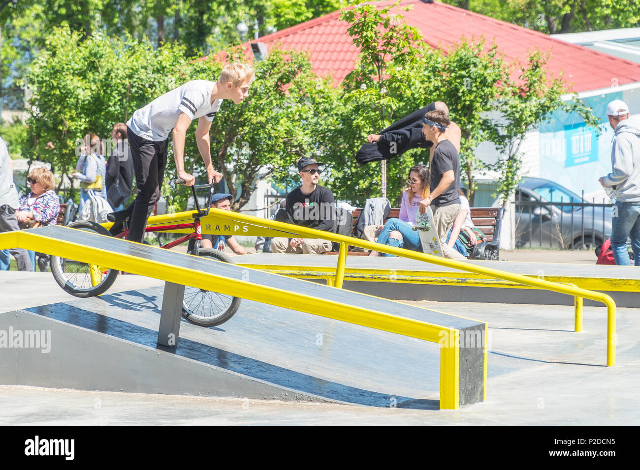 A cyclist riding on a BMX bike at the skatepark Stock Photo - Alamy