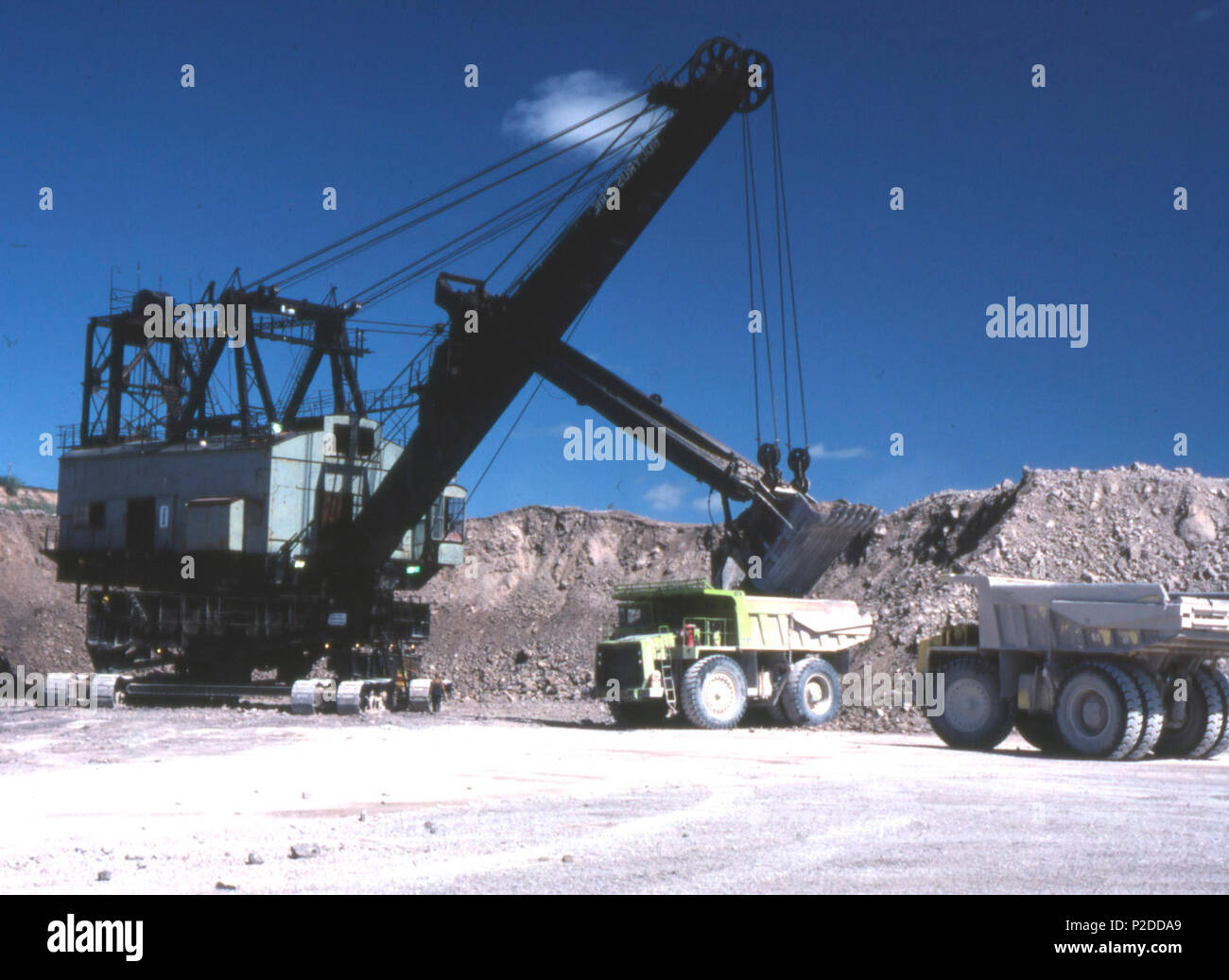 . English: Shovel loading trucks at Michigan Limestone . 1985 ...