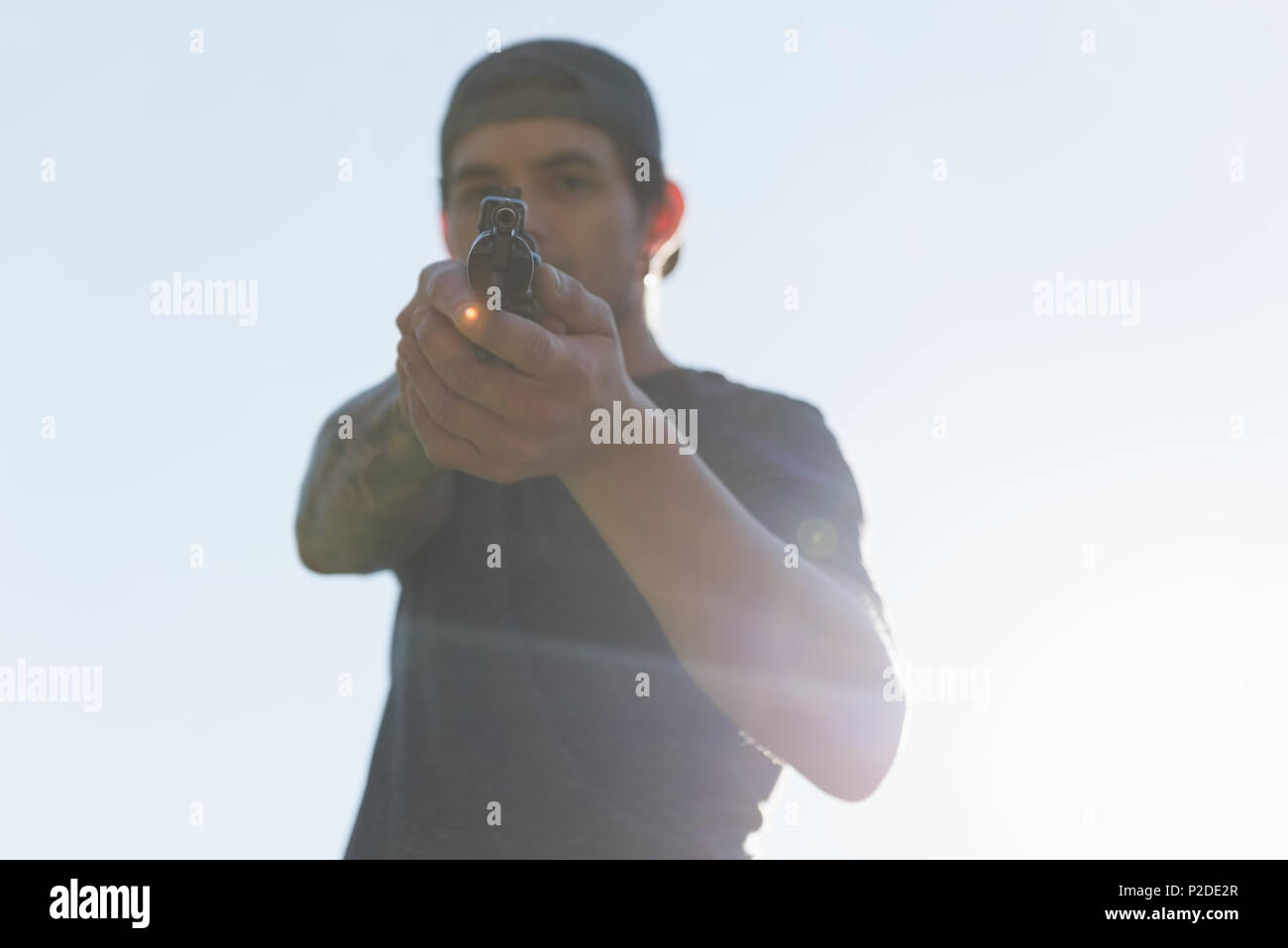 Man shooting target gun hi-res stock photography and images - Alamy