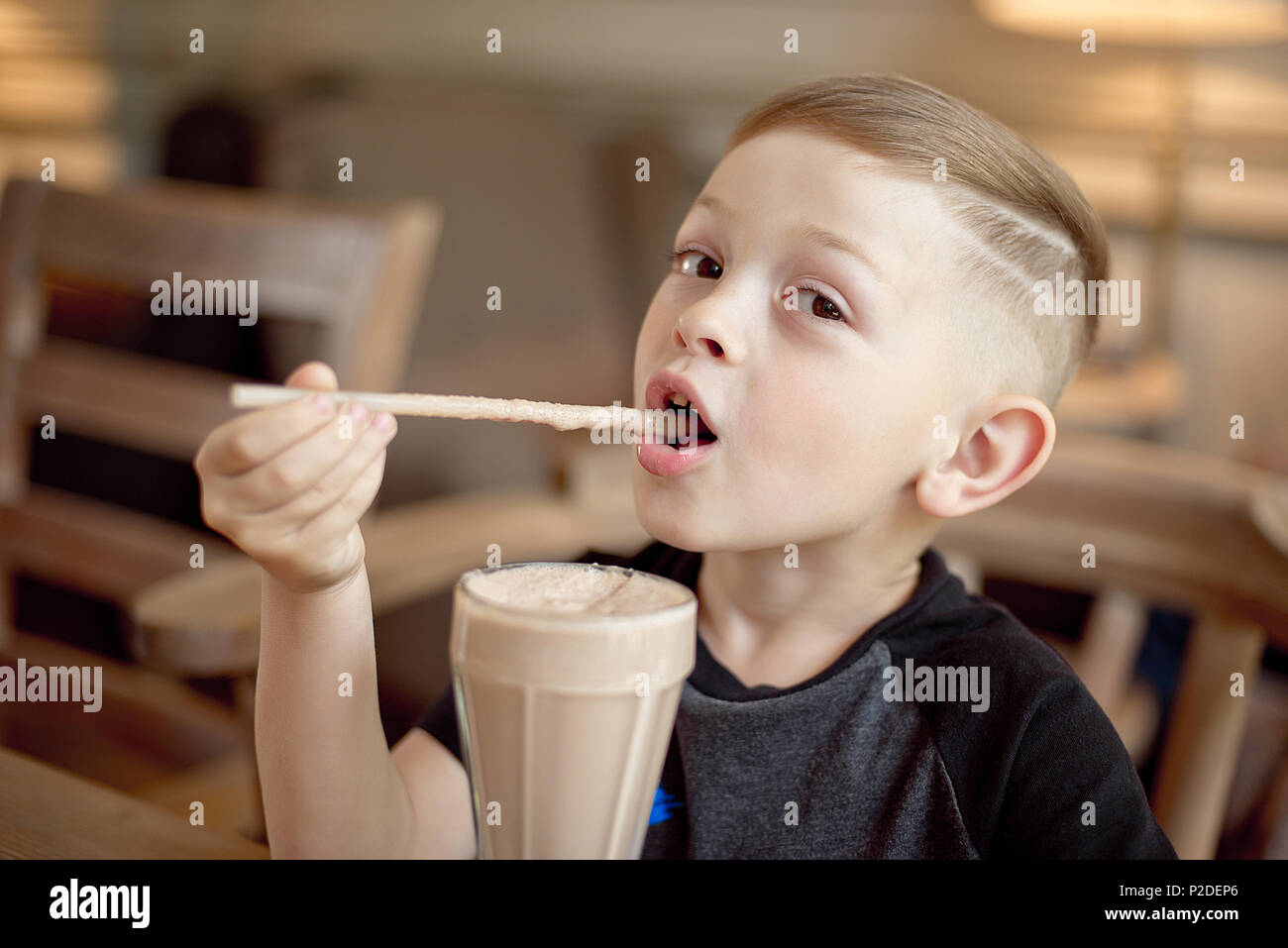 Boy In Cafe Drinking Milkshake High Resolution Stock Photography and ...