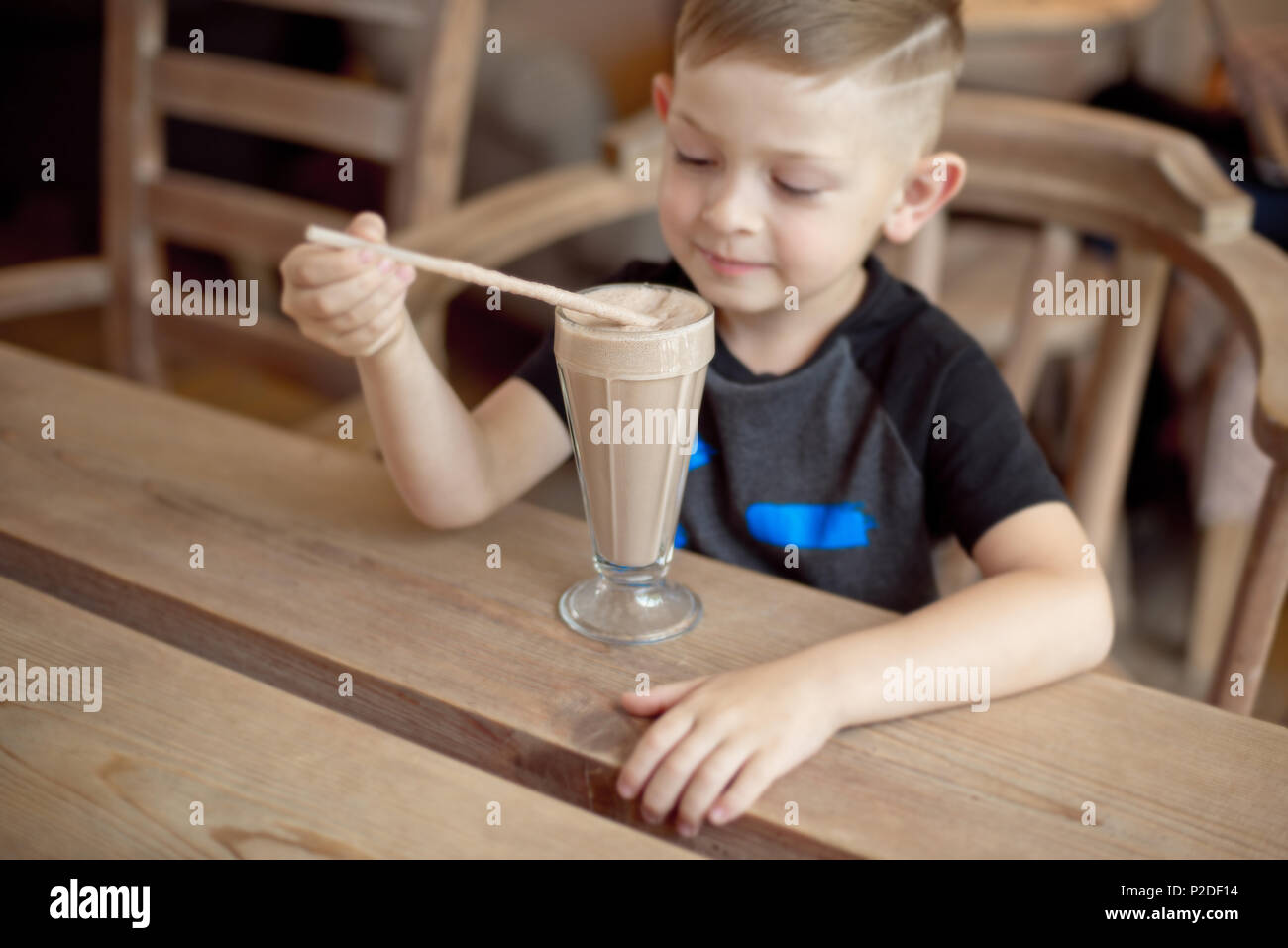Boy In Cafe Drinking Milkshake High Resolution Stock Photography and ...