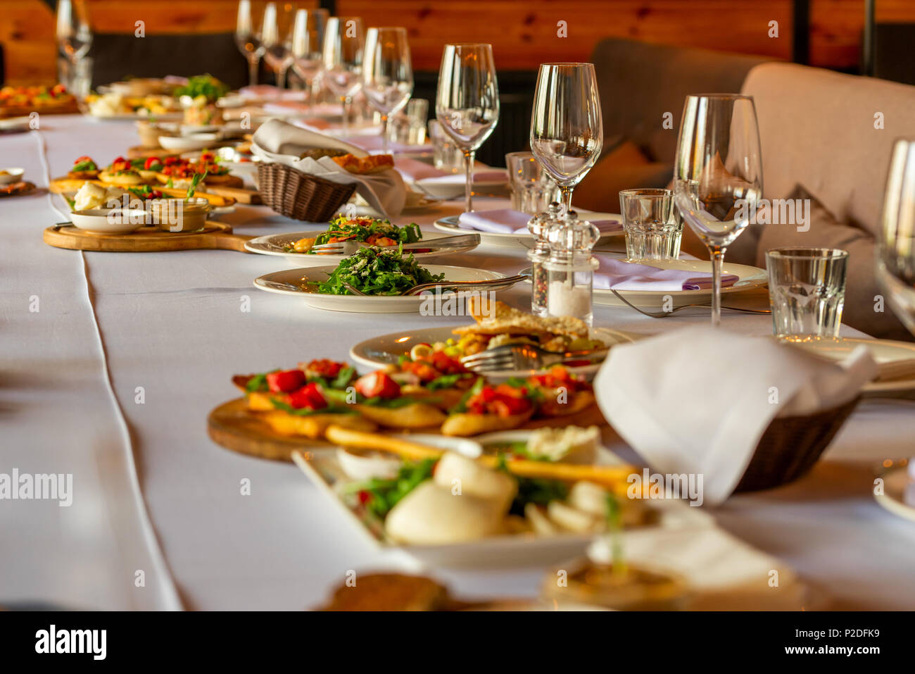 Served table with snacks and salads Stock Photo - Alamy