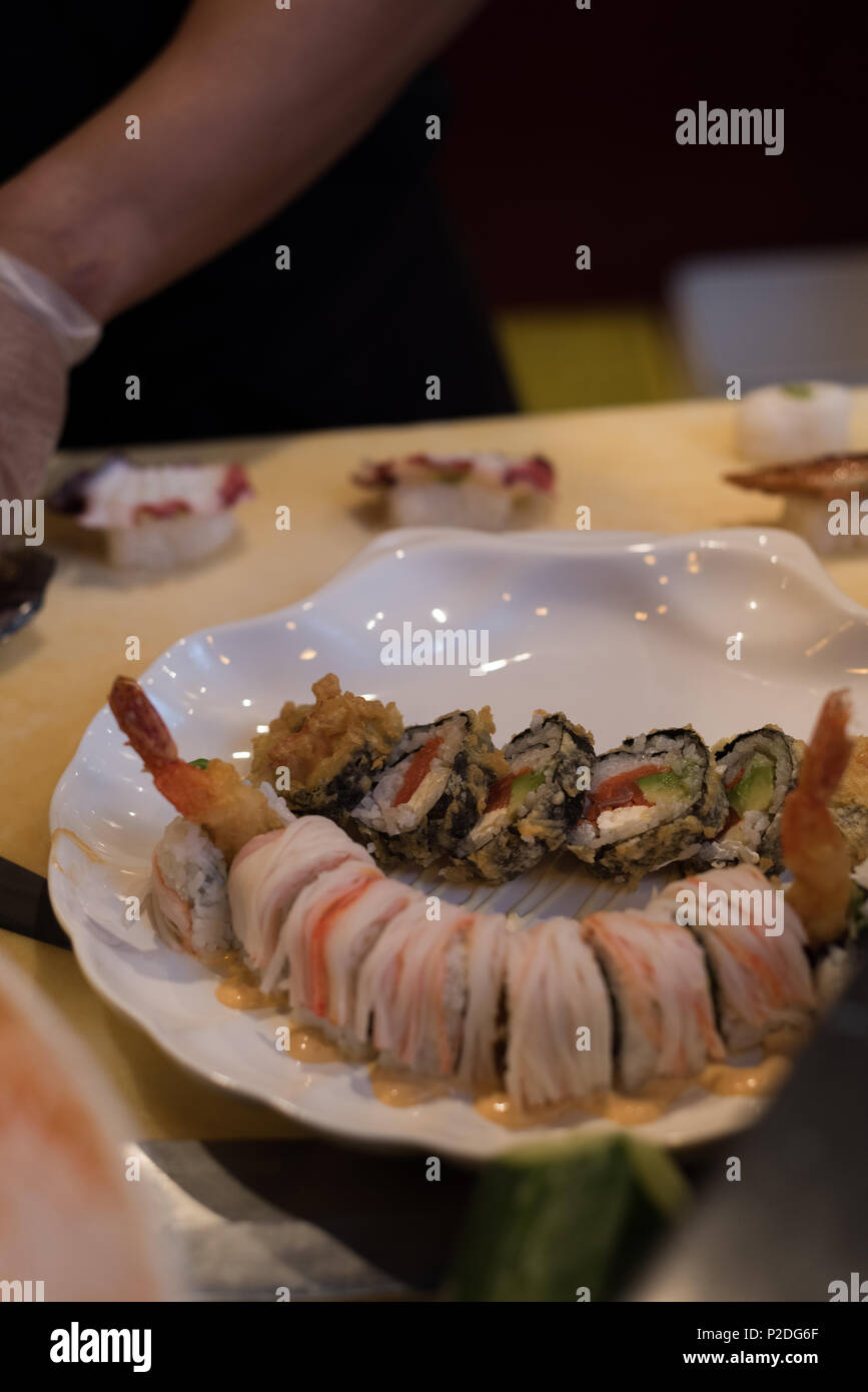 Sushi table arranged in a restaurant Stock Photo - Alamy