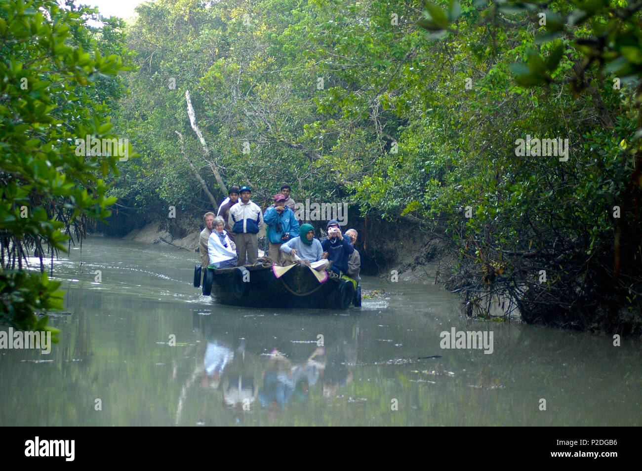 Tourists visit the Sundarbans by boat, a UNESCO World Heritage Site and ...