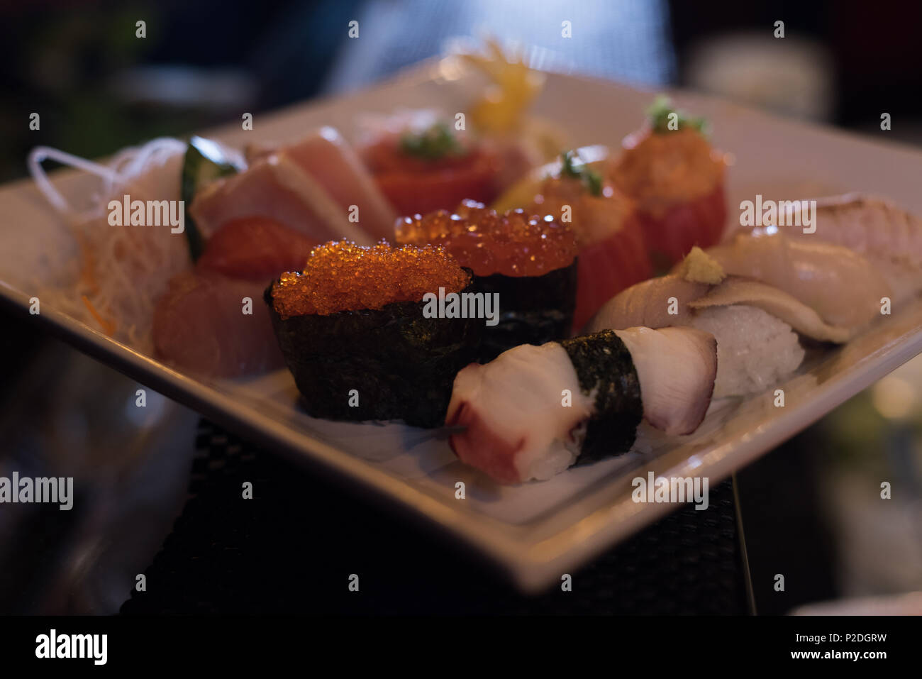 Sushi table arranged in a restaurant Stock Photo - Alamy