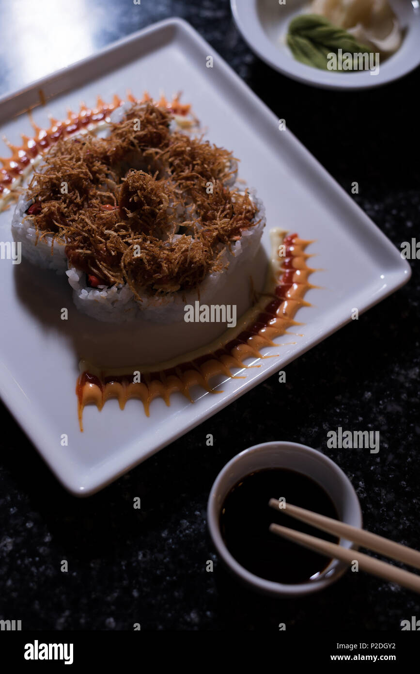 Sushi table arranged in a restaurant Stock Photo - Alamy