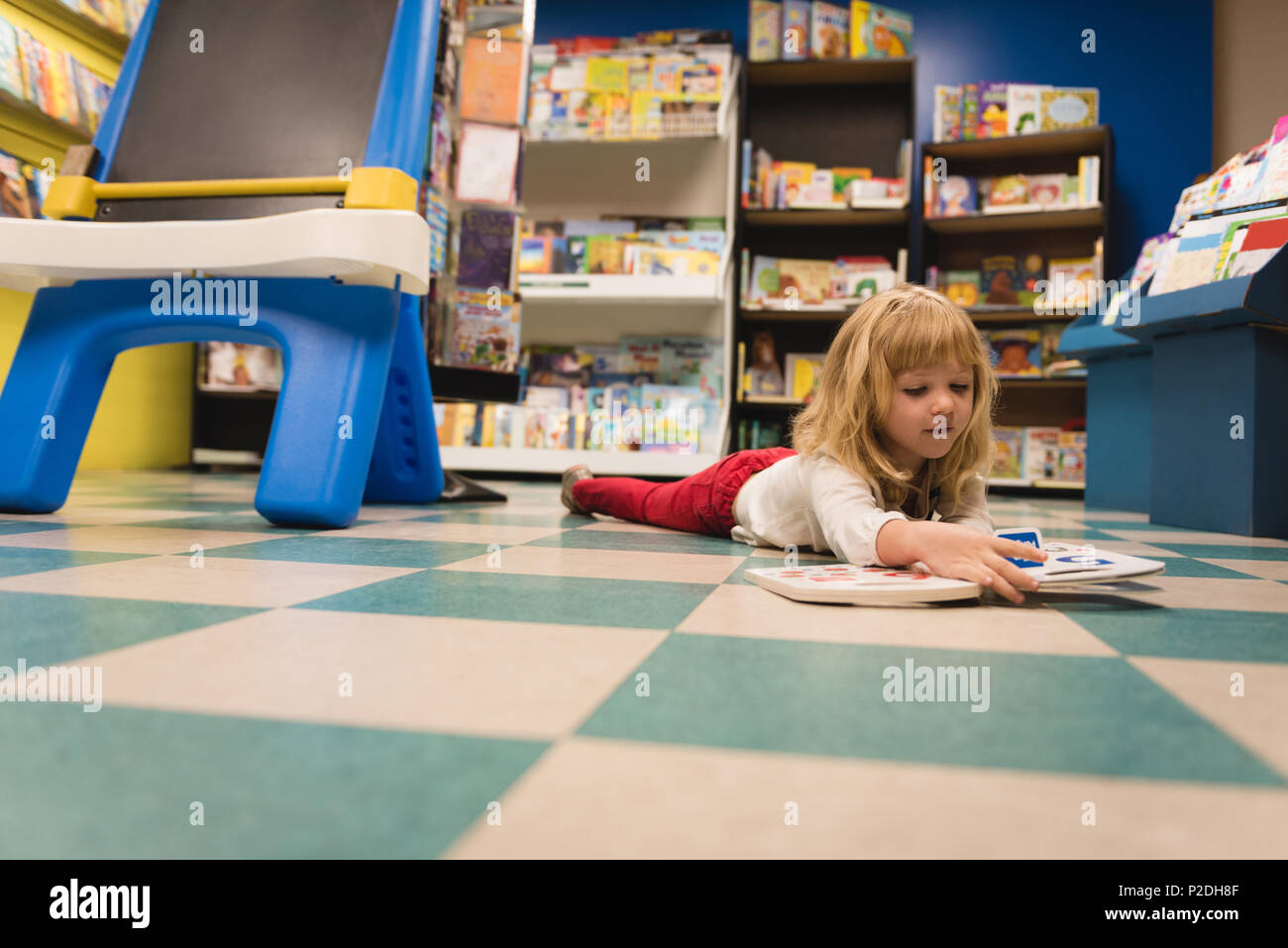 Girl reading a book Stock Photo - Alamy