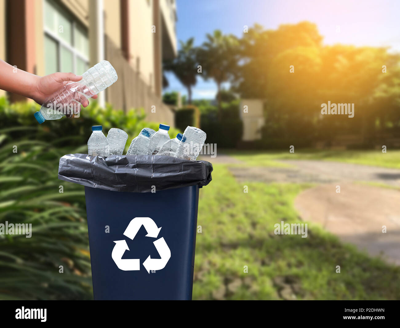 man hand putting plastic reuse for recycling concept environmental ...