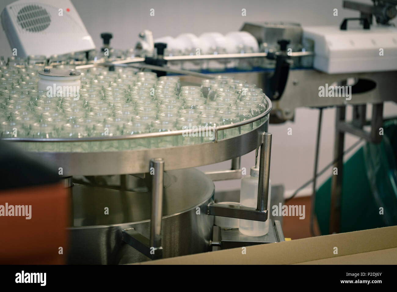 Empty glass jars on production line Stock Photo - Alamy
