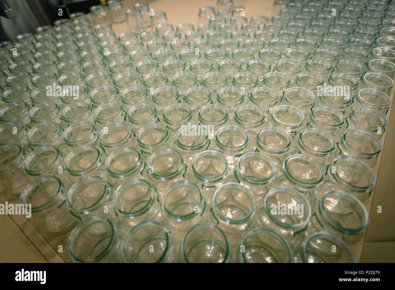 Empty glass jars on production line Stock Photo - Alamy