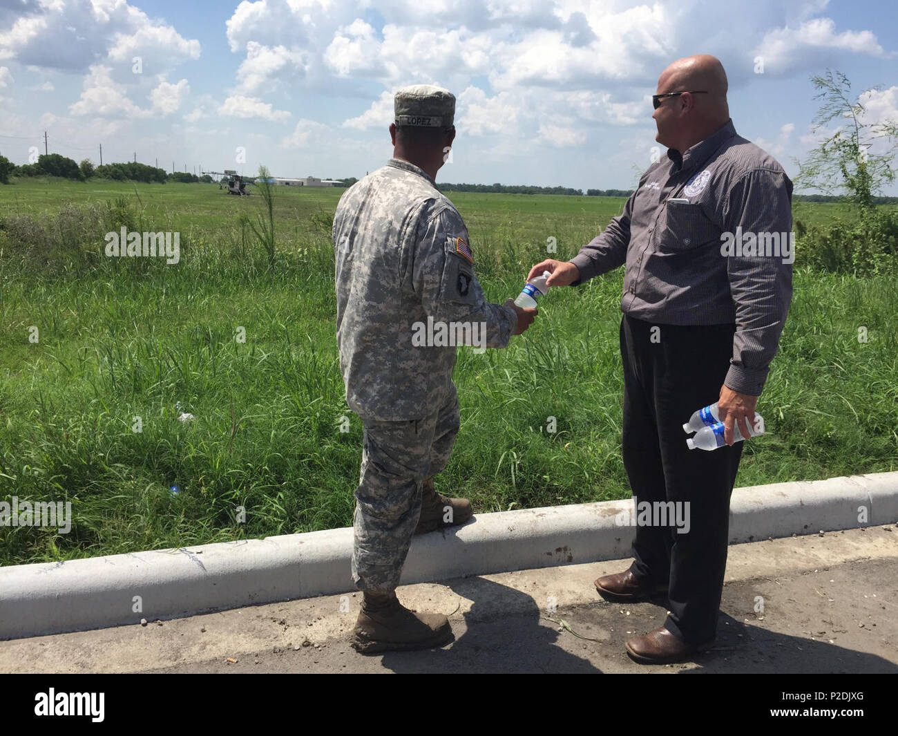 Judge Blake Sylvia, Chambers County Justice of the Peace, right, hands ...