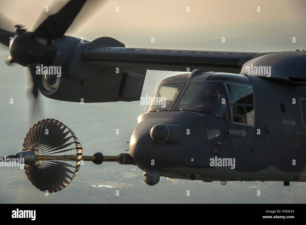 A CV-22 Osprey tiltrotor aircraft connects to an MC-130H Combat Talon ...