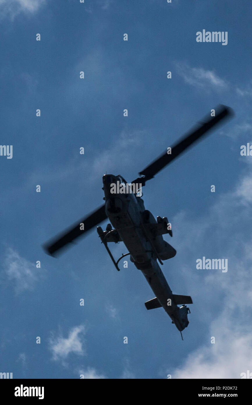 A U.S. Marine Corps AH-1W Super Cobra flies above the Cumberland River ...