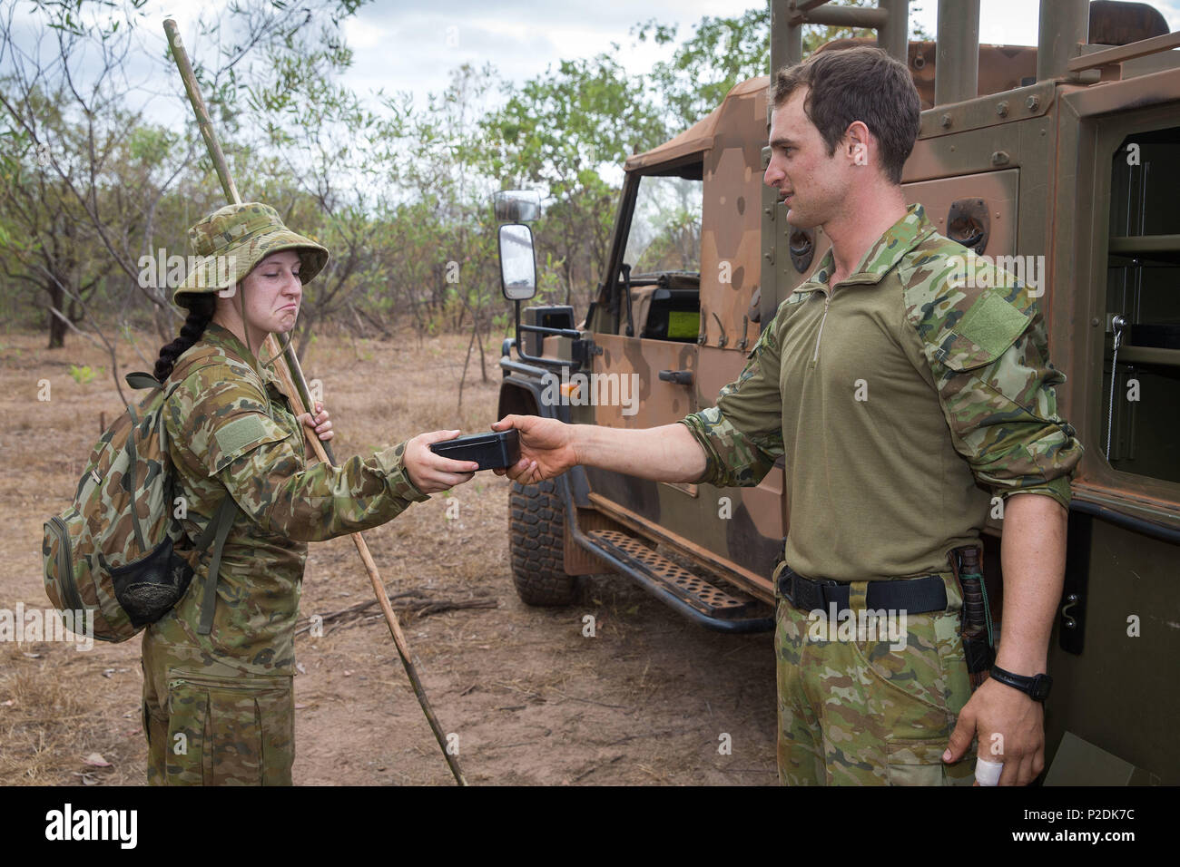Australian Army Private Melanie O'Sullivan hands over her survival kit to Australian Army ...