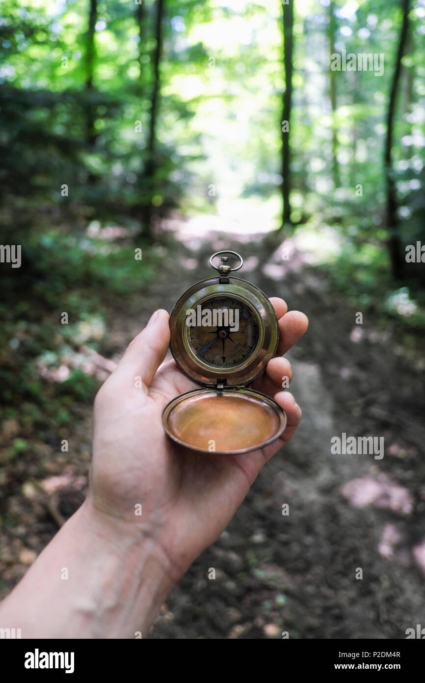 Man hand holding compass hi-res stock photography and images - Alamy