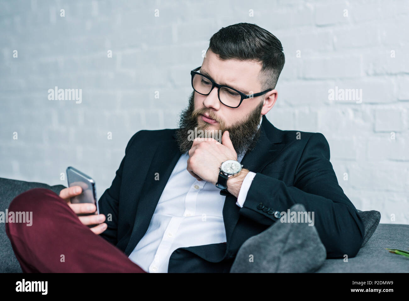 Portrait focused businessman using smartphone hi-res stock photography ...