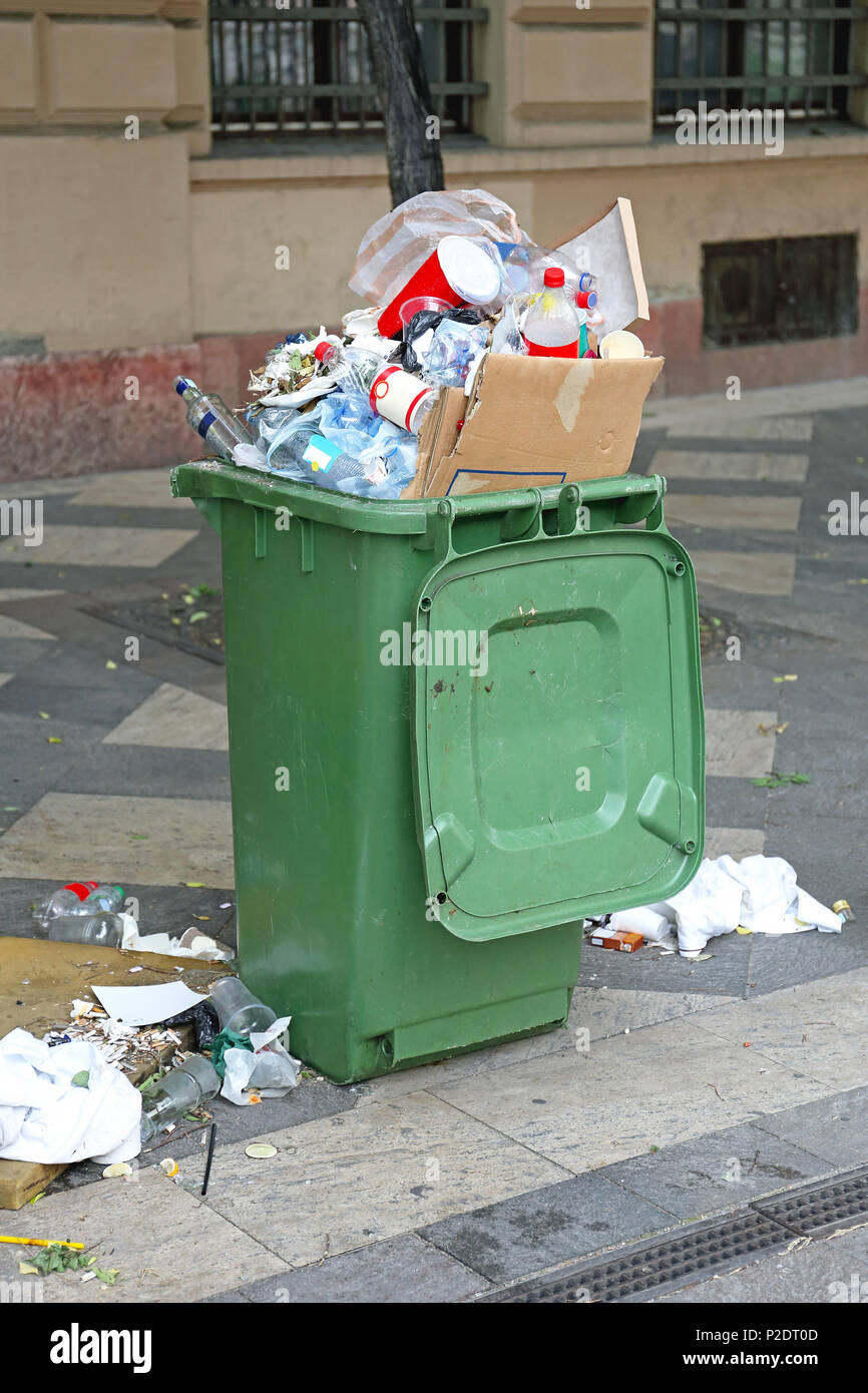 Overflow of Litter Garbage in Plastic Bin Stock Photo - Alamy