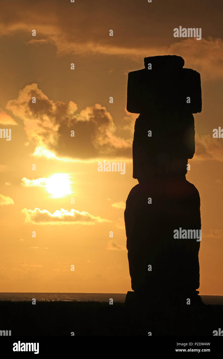 Silhouette of Moai statue against beautiful sunset sky at Ahu Tahai ...