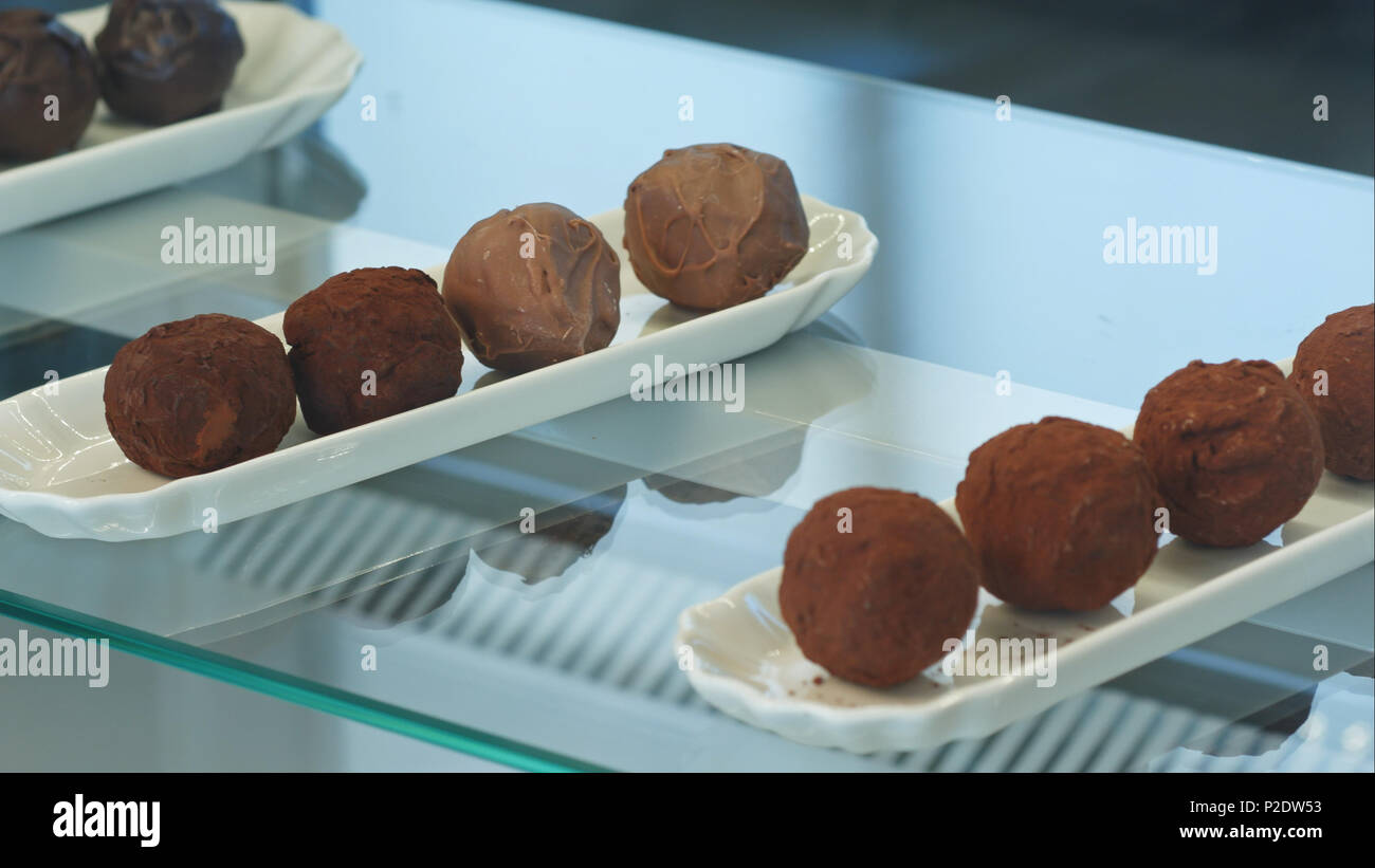 Shop window with stacks of chocolate sweets Stock Photo - Alamy