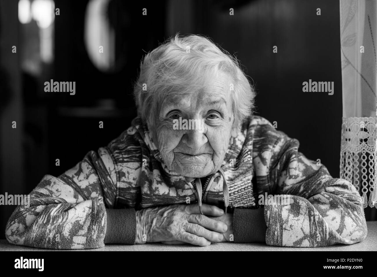 Beautiful older woman looking sad Black and White Stock Photos & Images ...