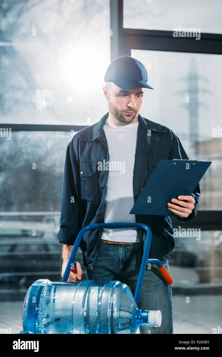 Man hand cart water delivery hi-res stock photography and images - Alamy