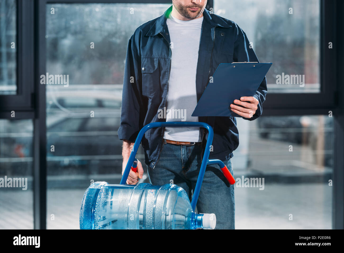 Man hand cart water delivery hi-res stock photography and images - Alamy