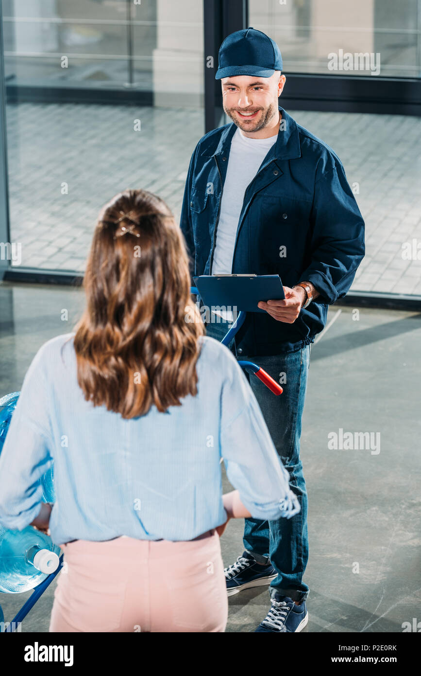 Woman receiving water bottles hi-res stock photography and images - Alamy