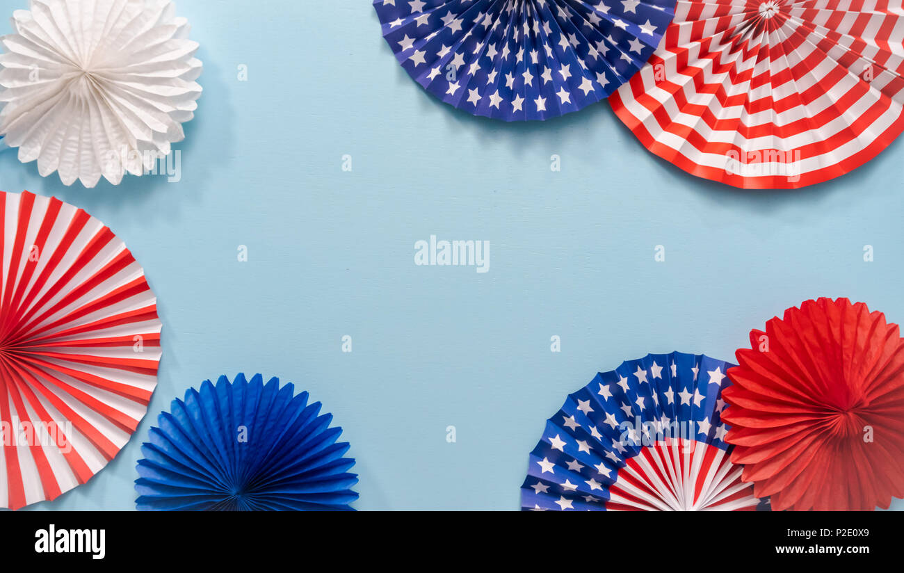 July 4th theme paper fans on blue background Stock Photo - Alamy