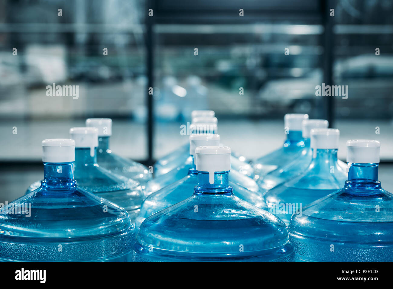 Rows of large blue water bottles Stock Photo - Alamy