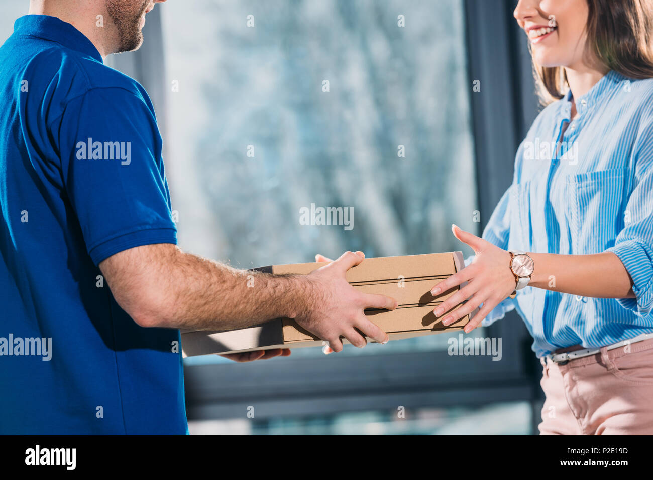 Young woman delivering food from hi-res stock photography and images ...