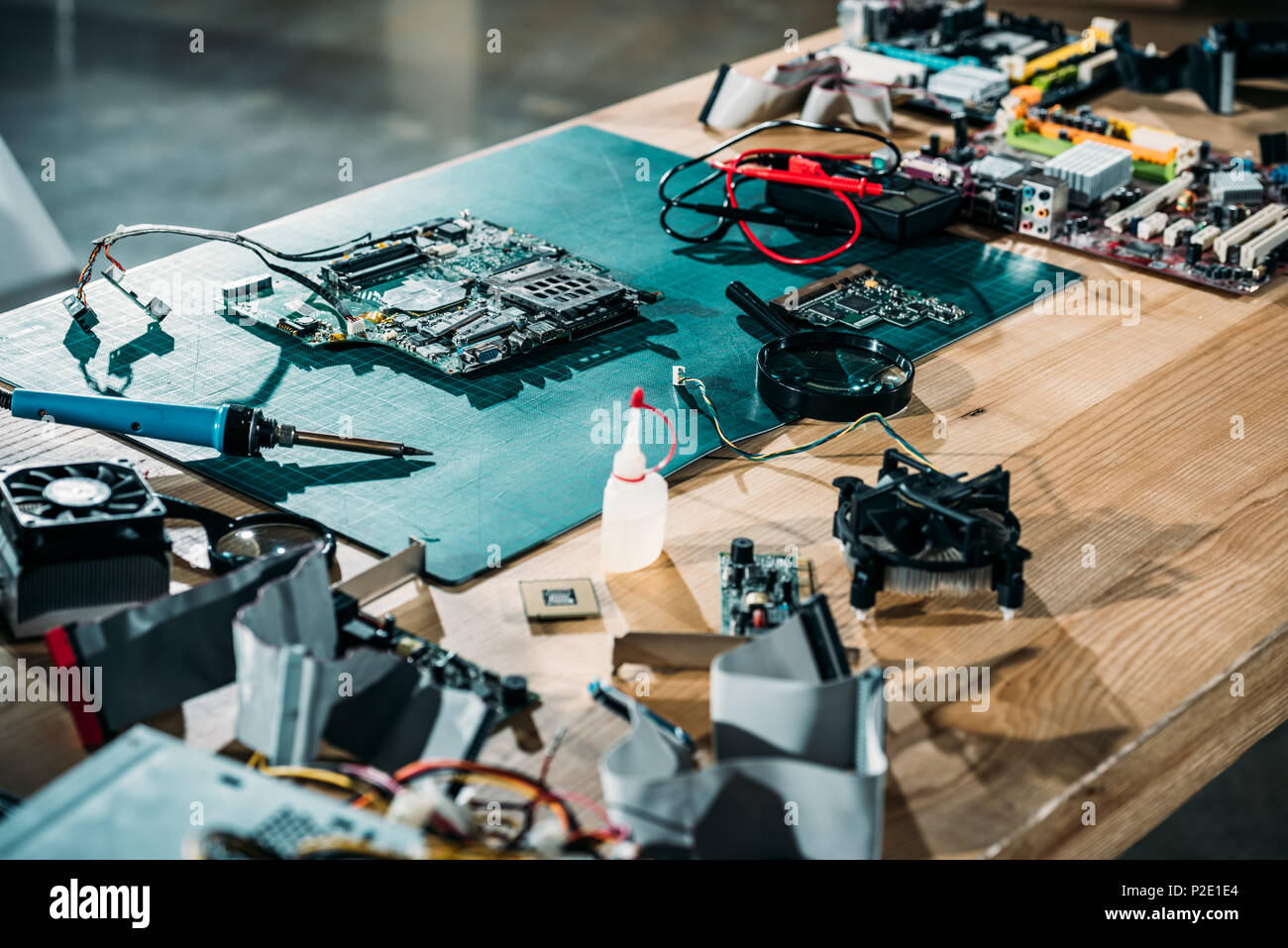 Repair table with circuit board and engineering equipment Stock Photo ...
