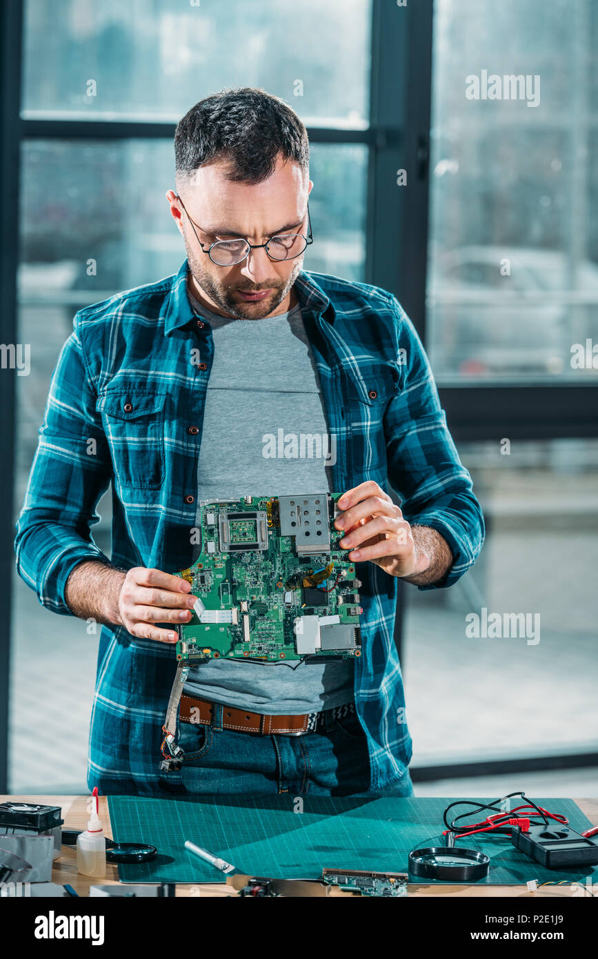 Electronics engineer checking circuit hi-res stock photography and ...
