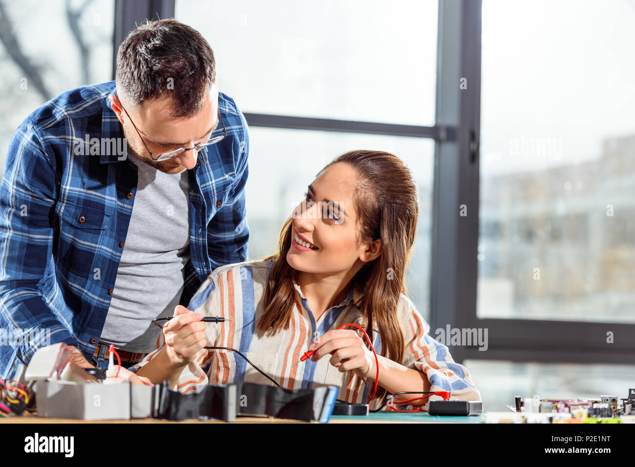 Team of engineers checking circuit board with multimeter Stock Photo ...