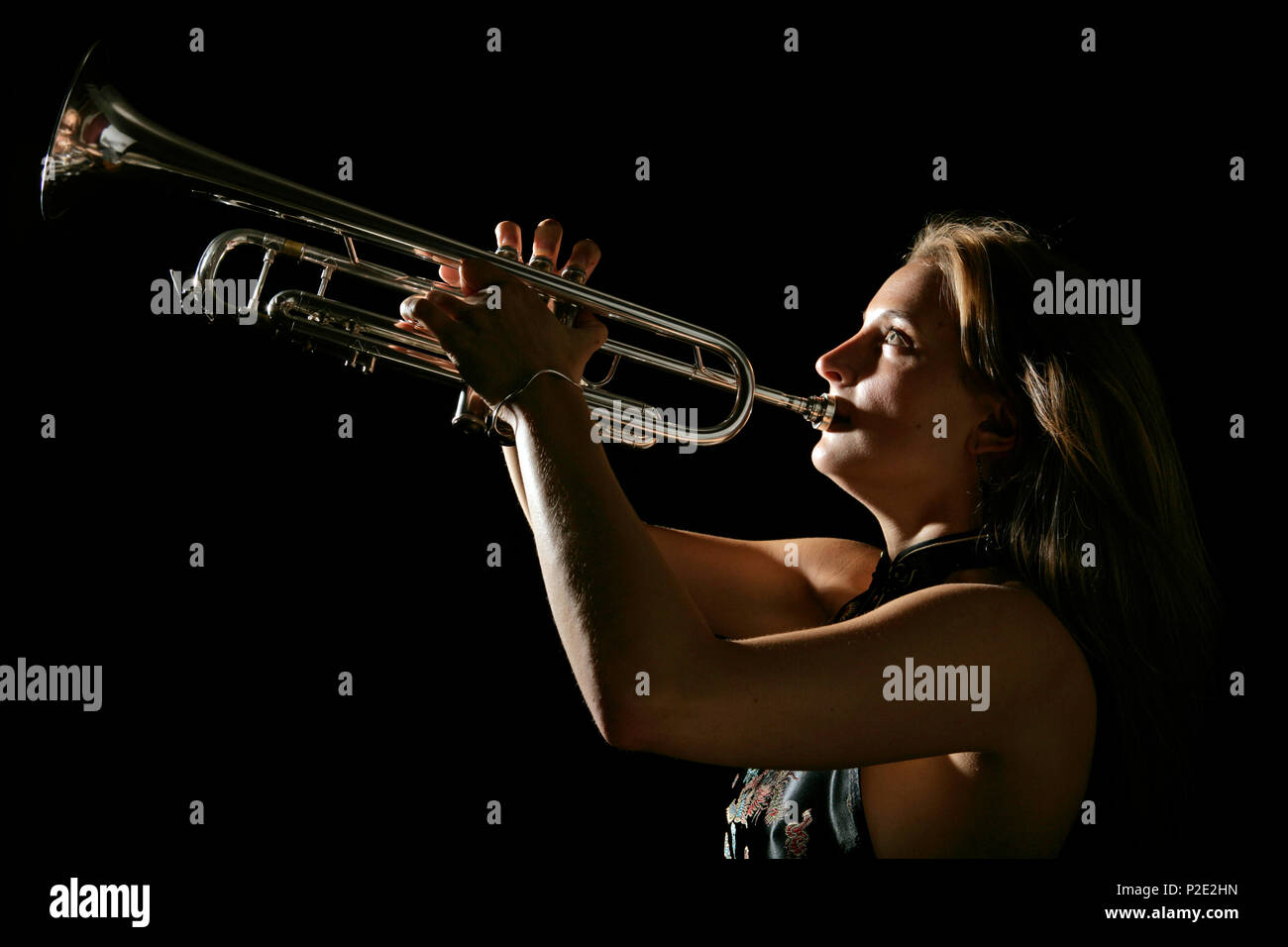 female musician playing the B flat Trumpet - generic Stock Photo - Alamy