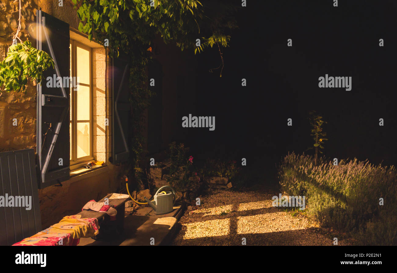 window casting light on garden in france Stock Photo - Alamy