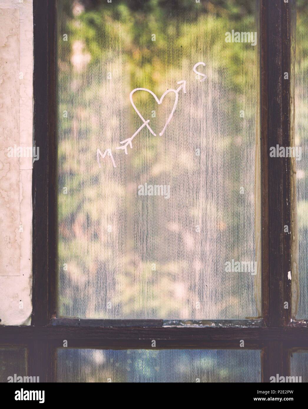 Love sign on a glass window Stock Photo - Alamy