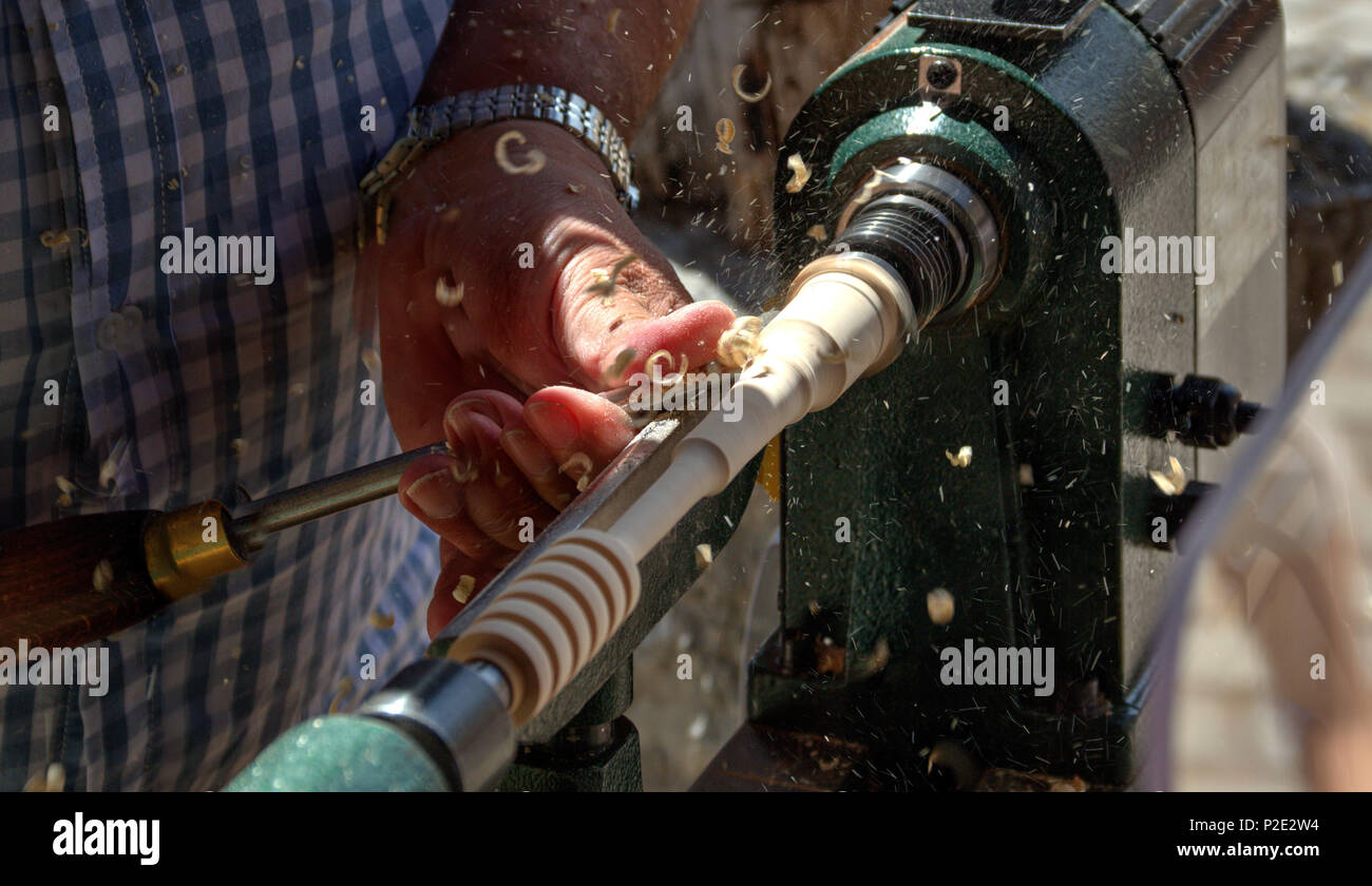 hand of a man using a tool to process wood in a machine Stock Photo - Alamy
