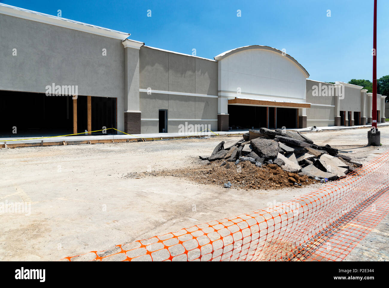 Horizontal angled shot of a retail strip shopping center under ...