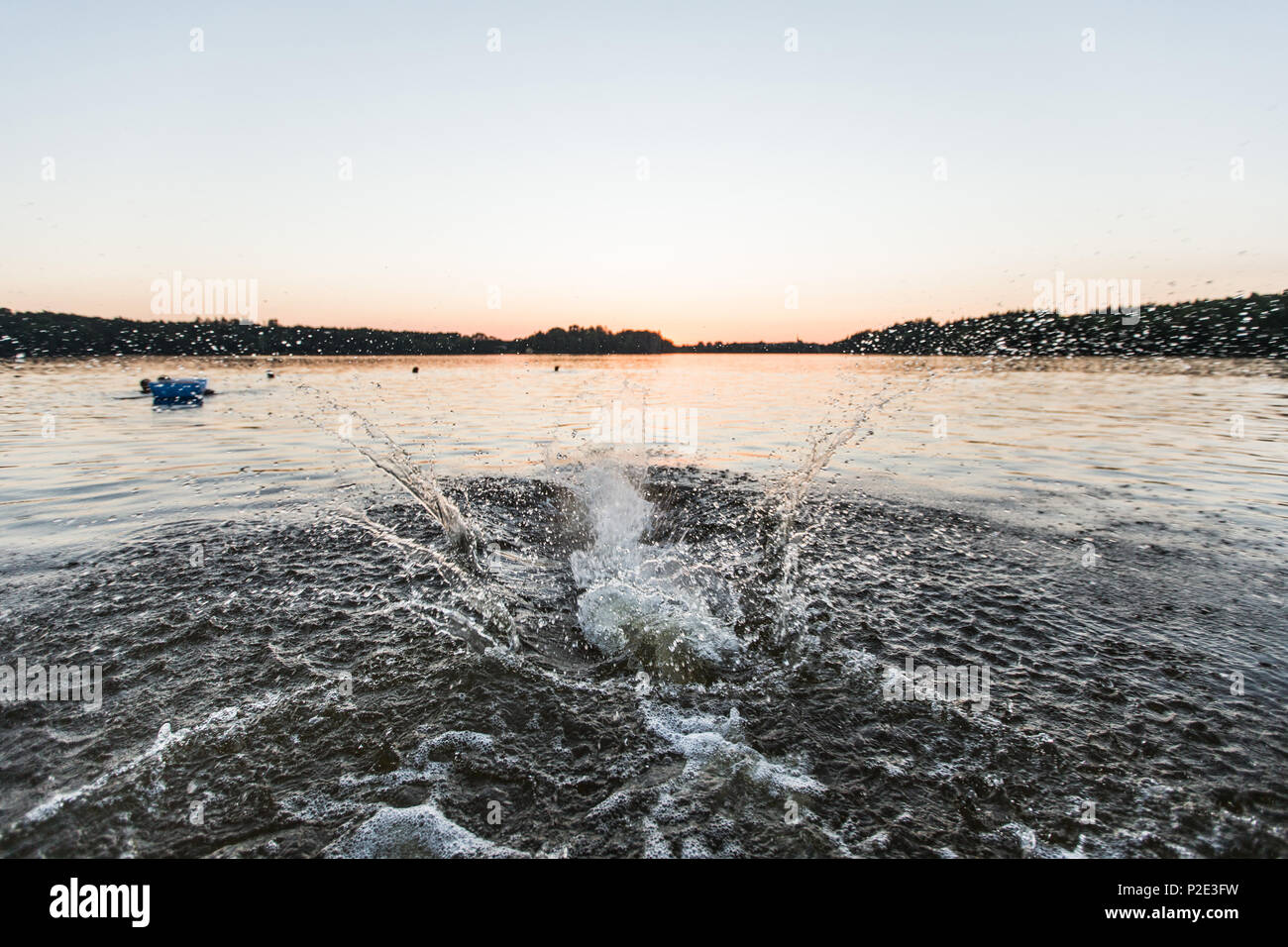 Man jumping into the water hi-res stock photography and images - Alamy
