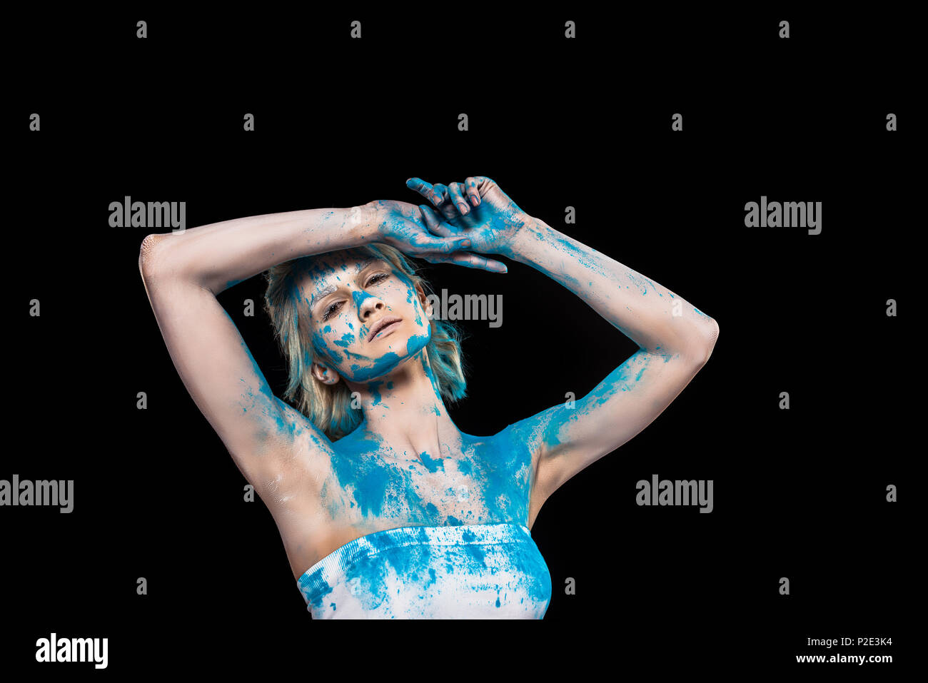 beautiful girl posing in blue holi powder, isolated on black Stock ...