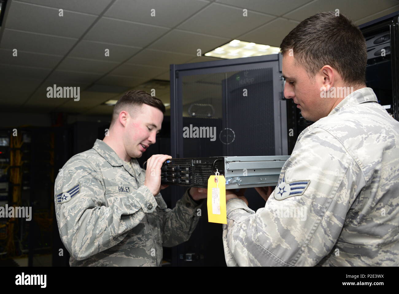 U.S. Air Force Senior Airmen Bradley Haley and Caige Kelly, 355th Communications Squadron ...