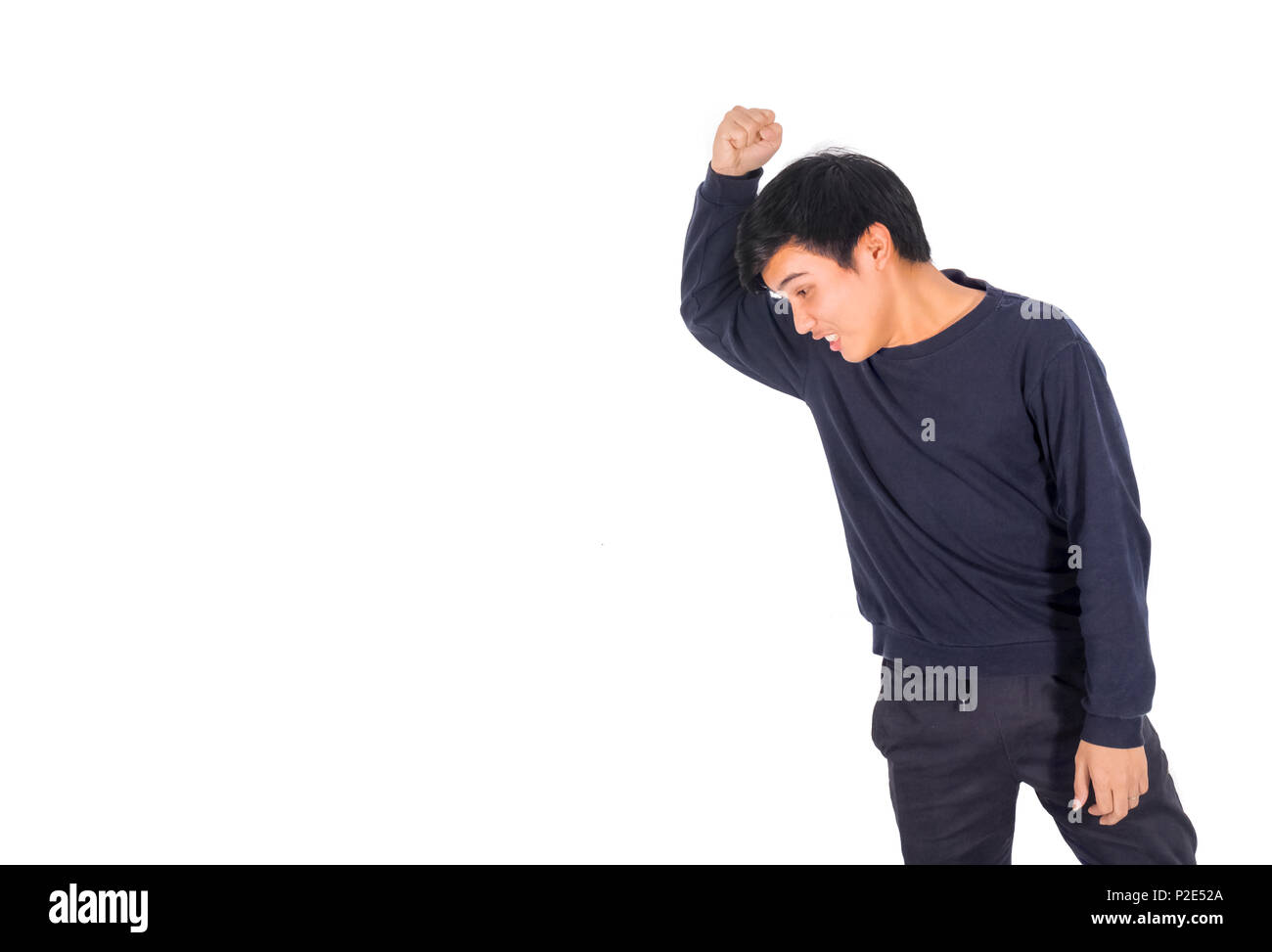 The photo of An Asian man is smashing thing with one hand on white ...