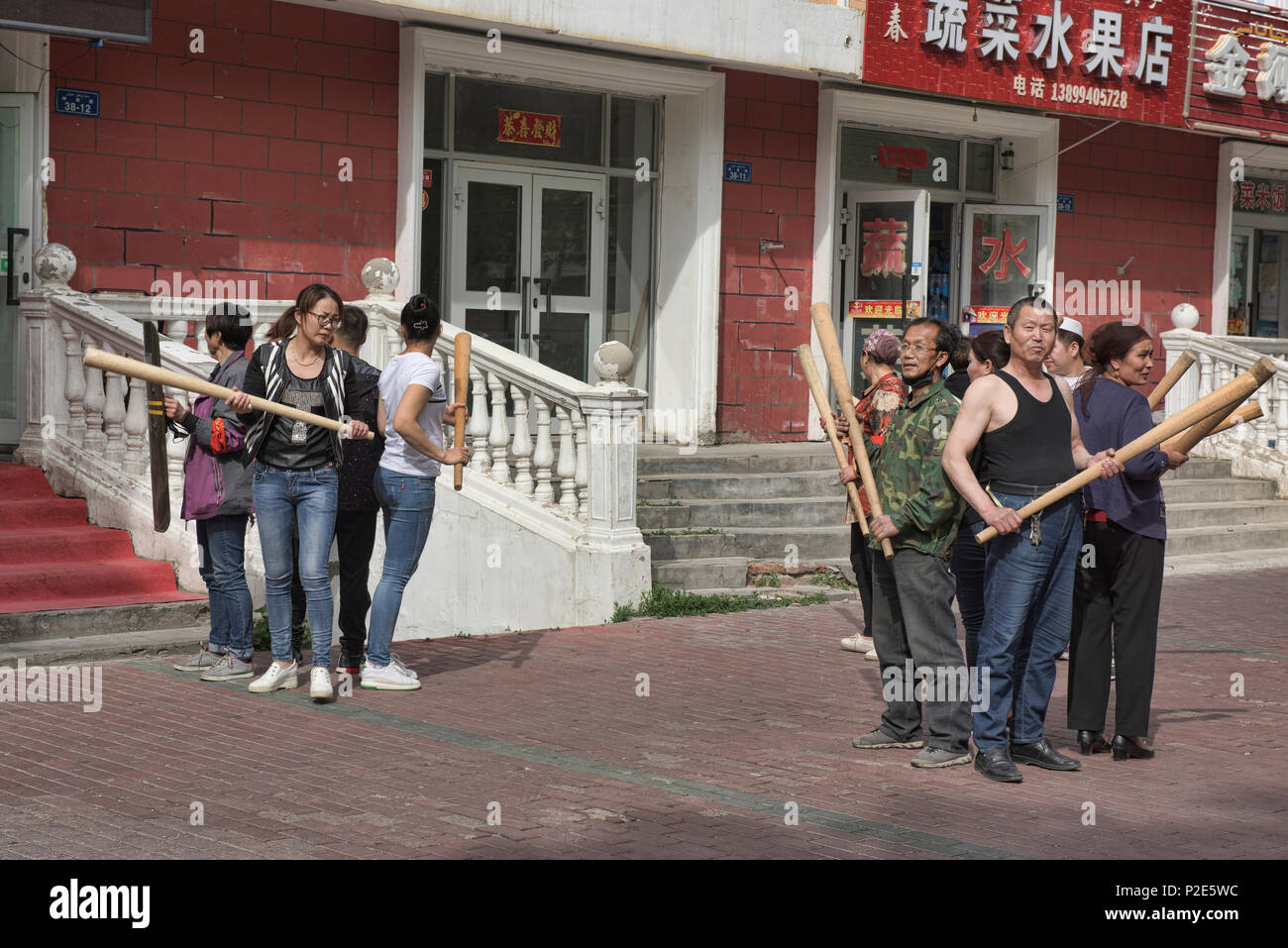 Thug Chinese security unit with bats, Xinjiang, China Stock Photo - Alamy