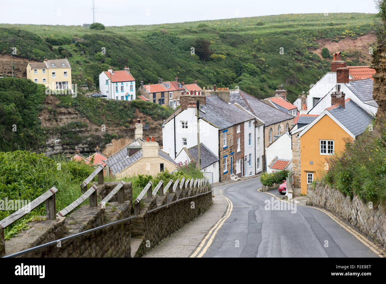 The steep road down into the village of Staithes, North Yorkshire ...