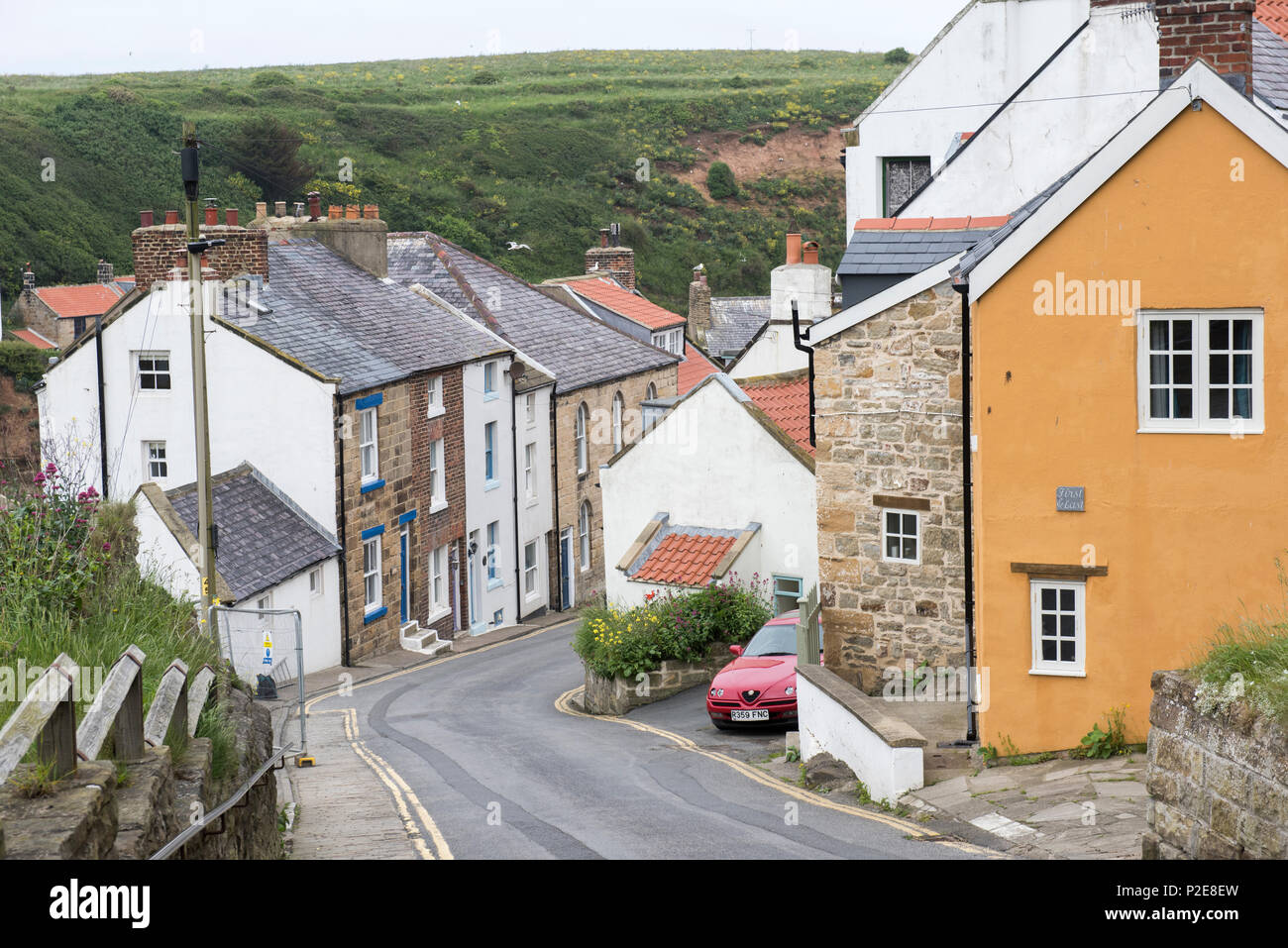 The steep road down into the village of Staithes, North Yorkshire ...