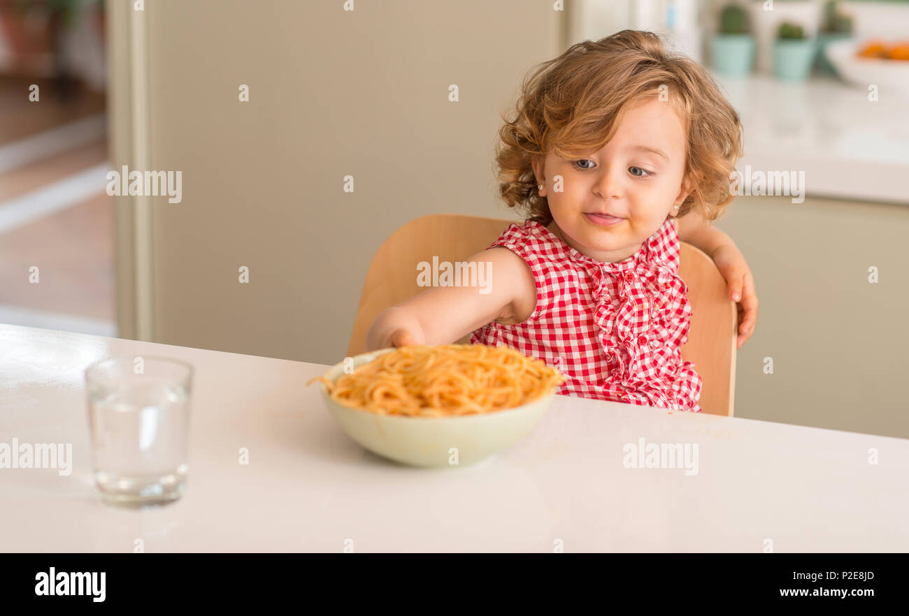 Child eating spaghetti with hands hi-res stock photography and images ...