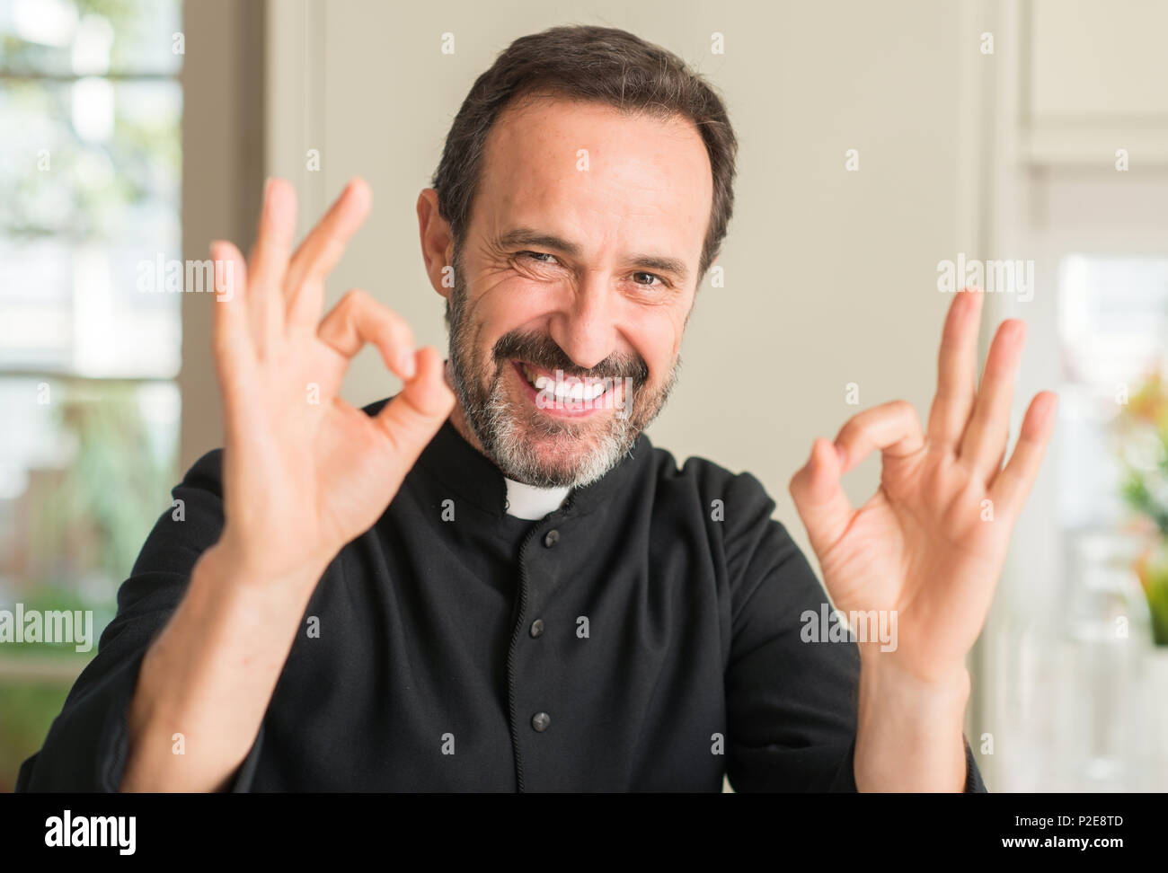 Christian priest man confident expression hi-res stock photography and ...